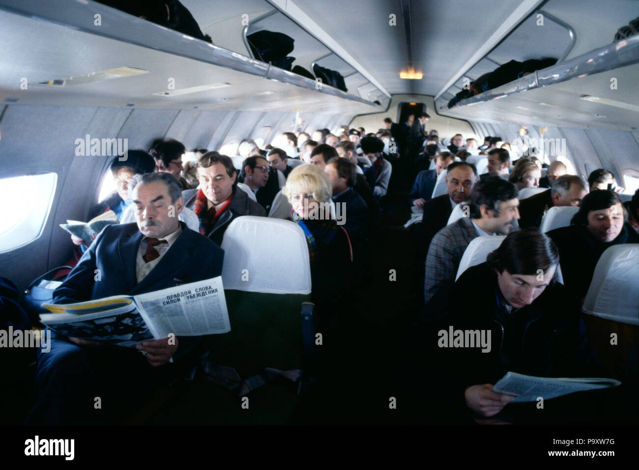 Passengers sit inside the Yakovlev YAK-42 of Aeroflot Soviet Airlines ...