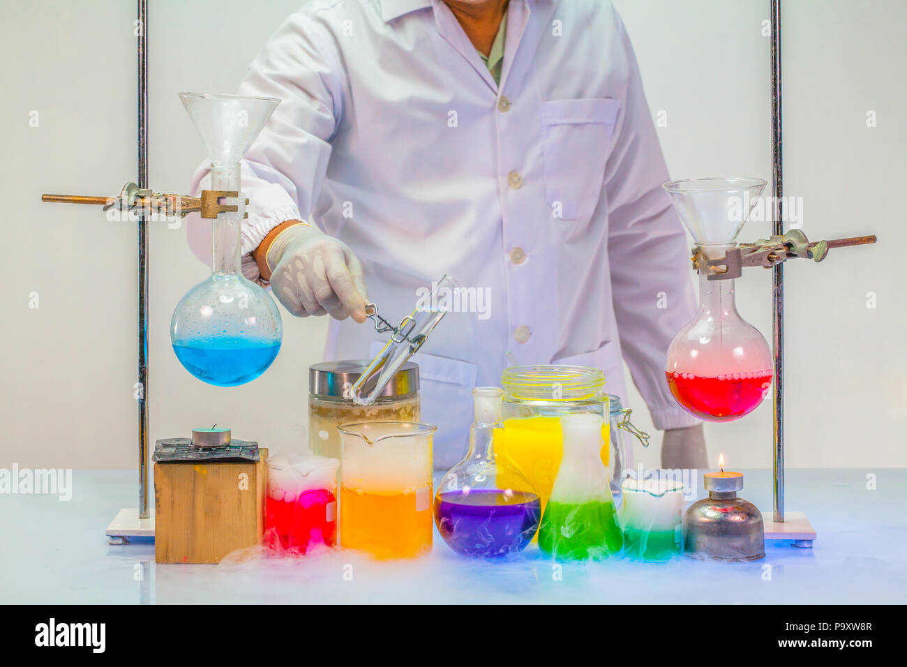a scientist testing in laboratory experiments in chemical blending ...