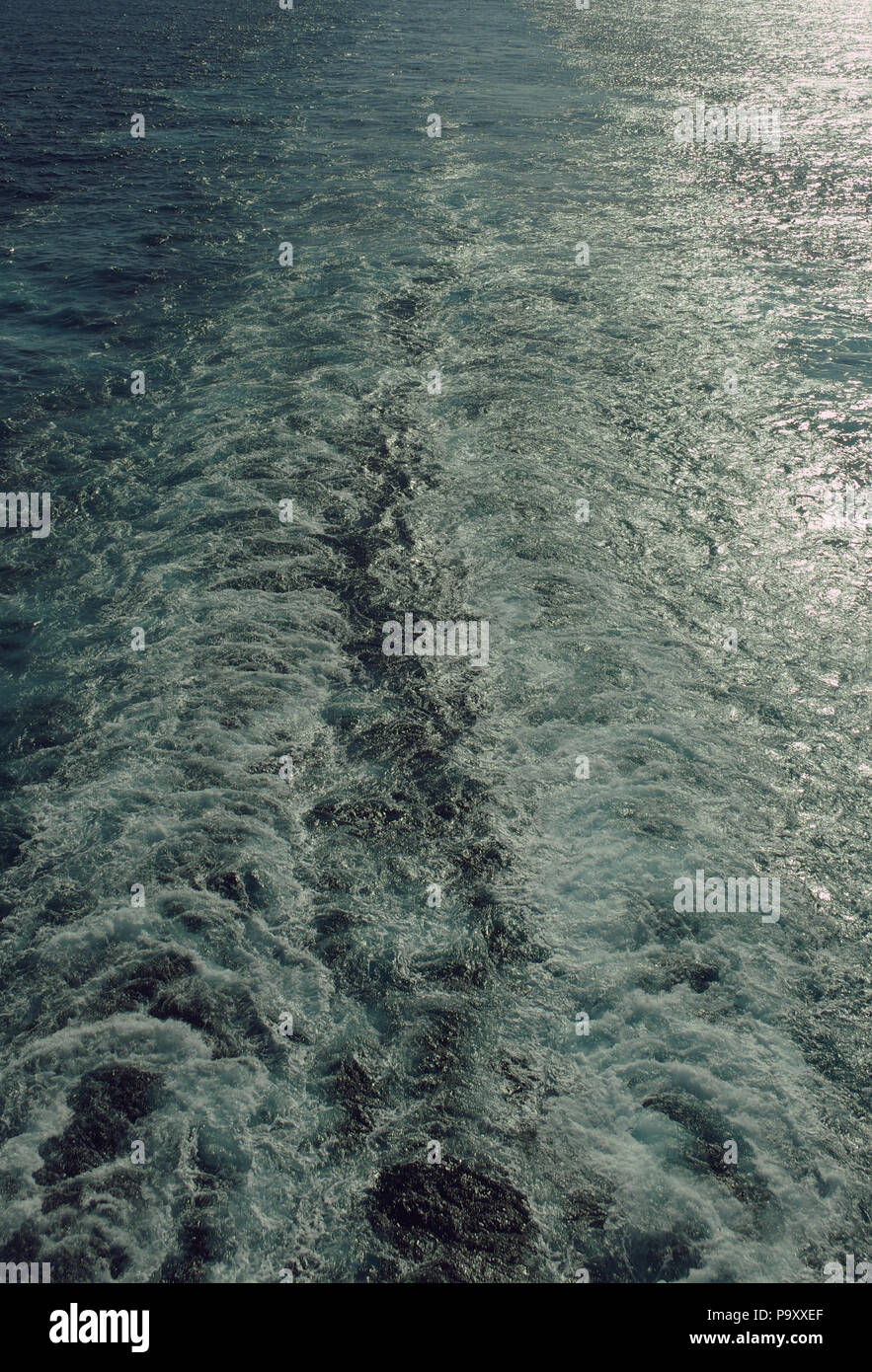 Wake of a cruise ship against the light Stock Photo - Alamy