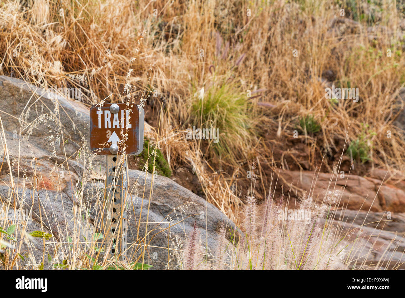 Metal trailhead sign Stock Photo - Alamy