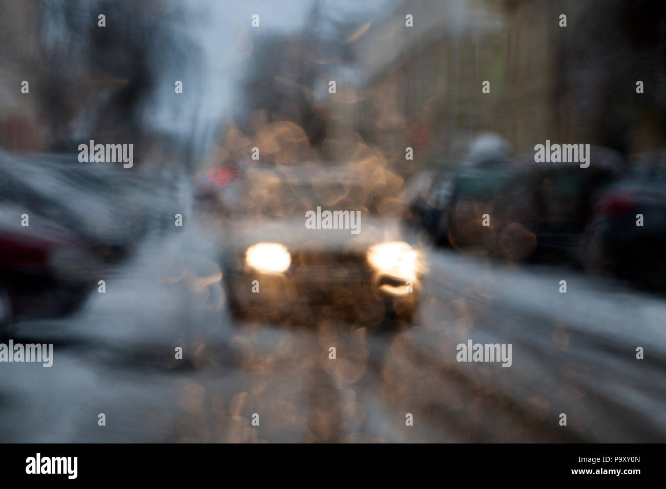 photographed road defocusing , Closeup, visible white car headlight ...