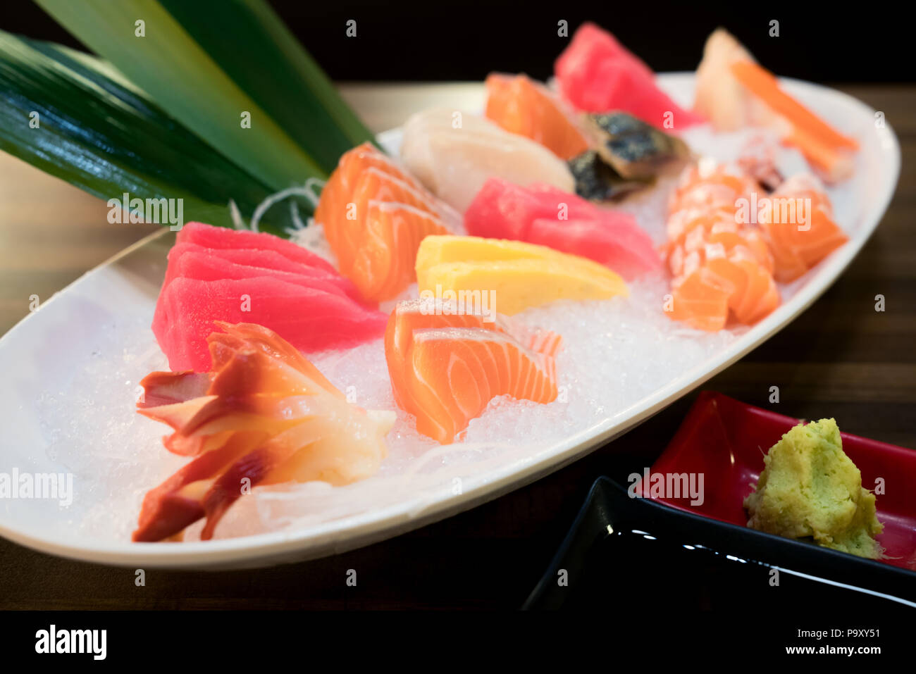 Mixed sliced fish sashimi on ice in white bowl. Sashimi Salmon Tuna ...