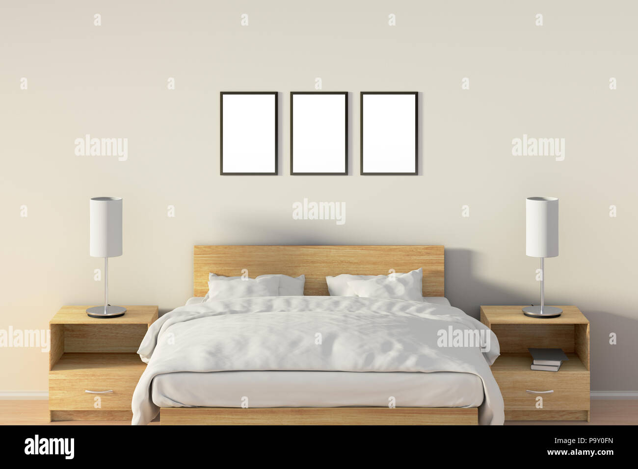 Three blank vertical posters in bedroom over wooden bed. Isolated with ...