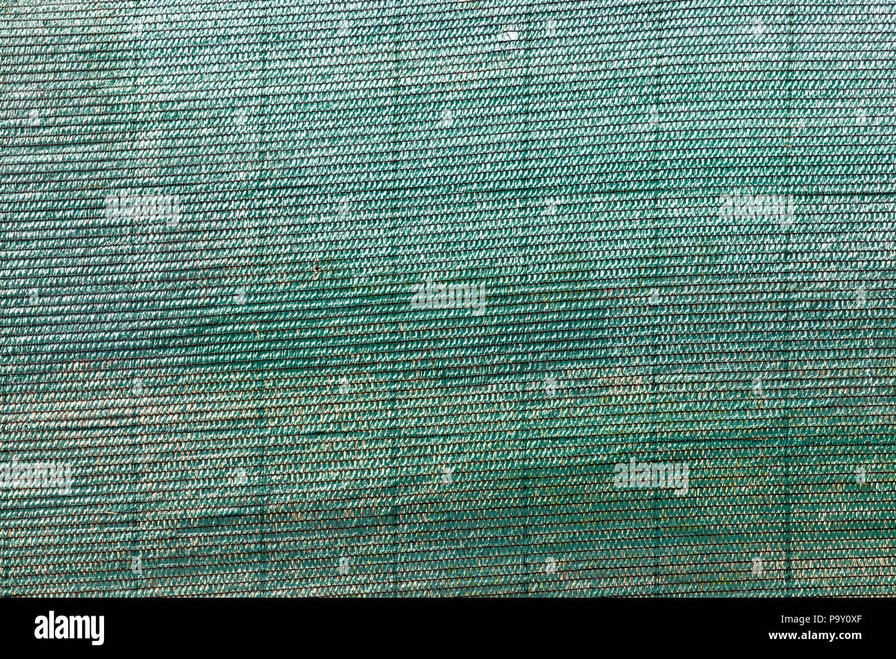 green mesh used in construction for fencing and security in the ...