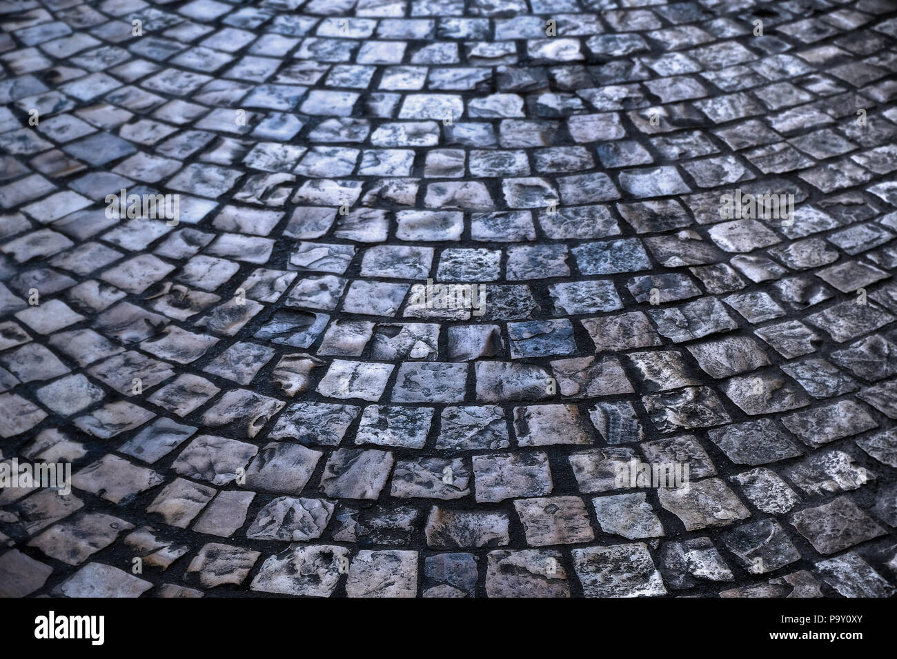 old cobblestone street dark night background texture Stock Photo - Alamy