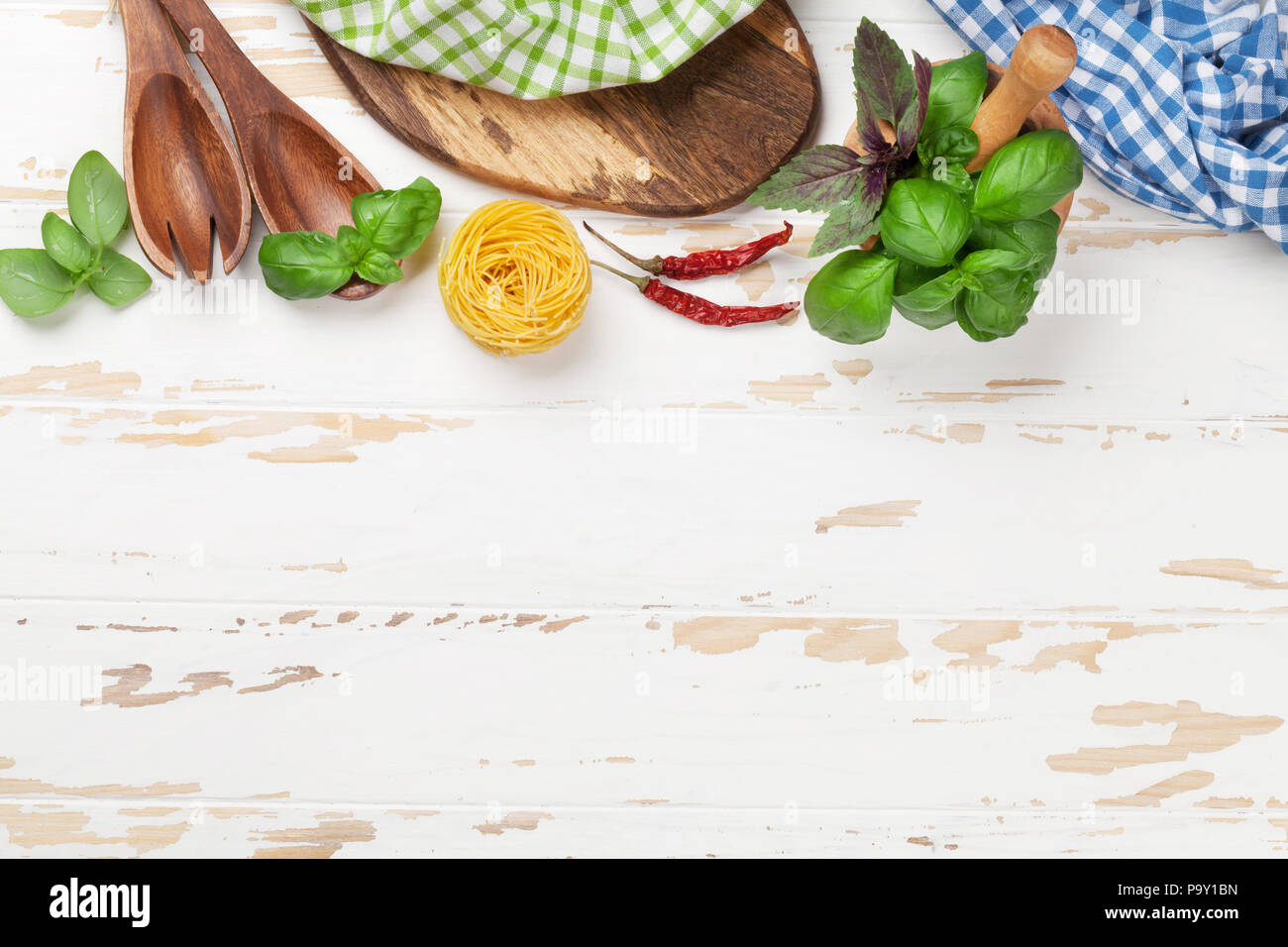 Cooking table with utensils and ingredients on white wood. Top view ...