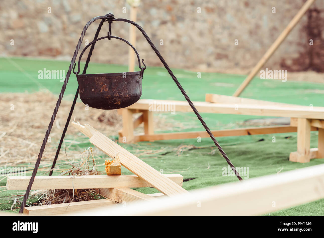 decorative pot hanging over a tree on artificial grass Stock Photo - Alamy