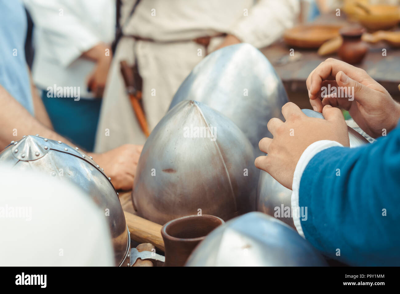 Medieval knights ' helmets with accessories are on the shelves Stock ...
