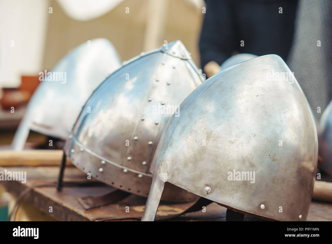 Medieval knights ' helmets with accessories are on the shelves Stock ...