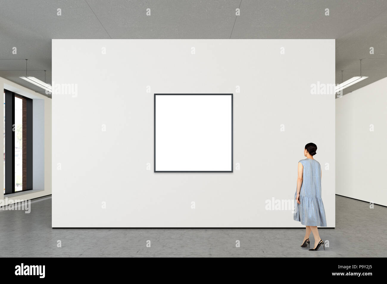 Woman looking at blank square poster in modern gallery. Poster isolated ...