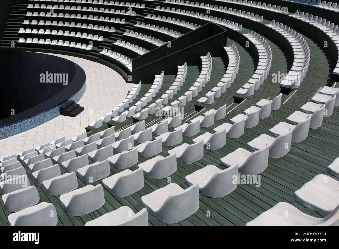 The grandstands of a modern outdoor amphitheater, a stage for small ...