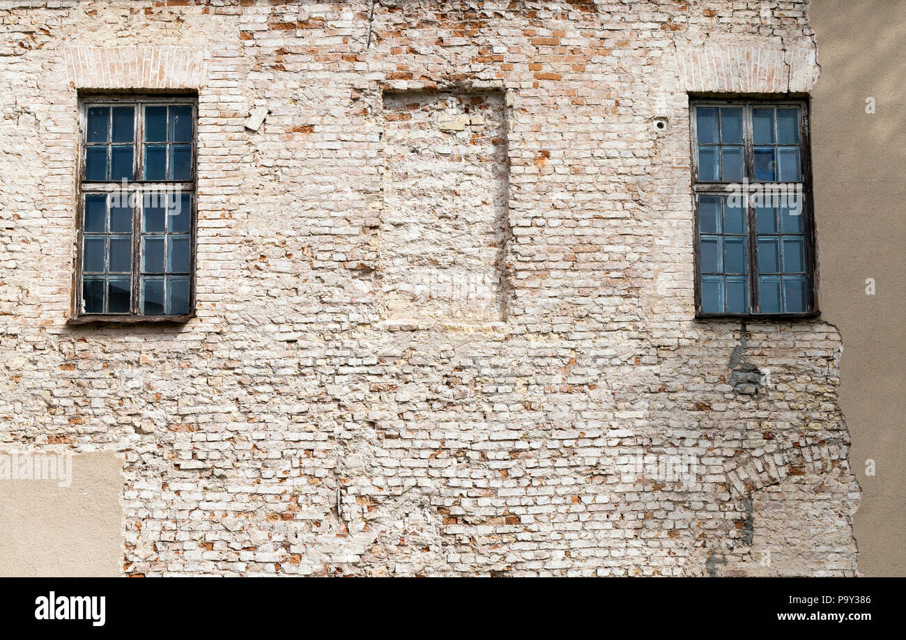 old brick wall, and part of the plaster during the restoration and ...