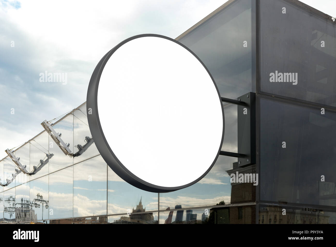 Blank round signboard on the glass wall. 3d illustration Stock Photo ...