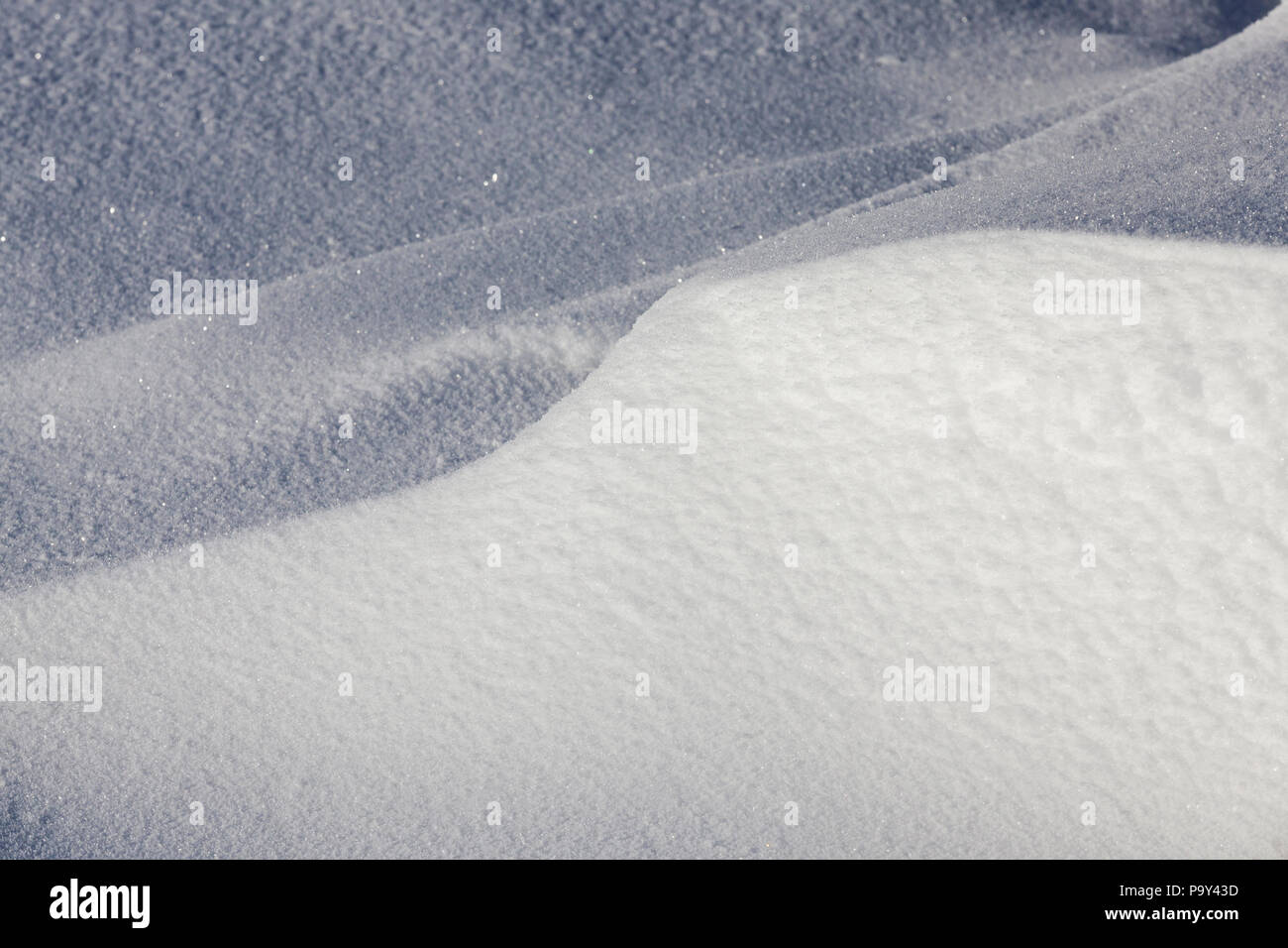 solid snow falling on the ground. Photo of a close-up of snow drifts in ...