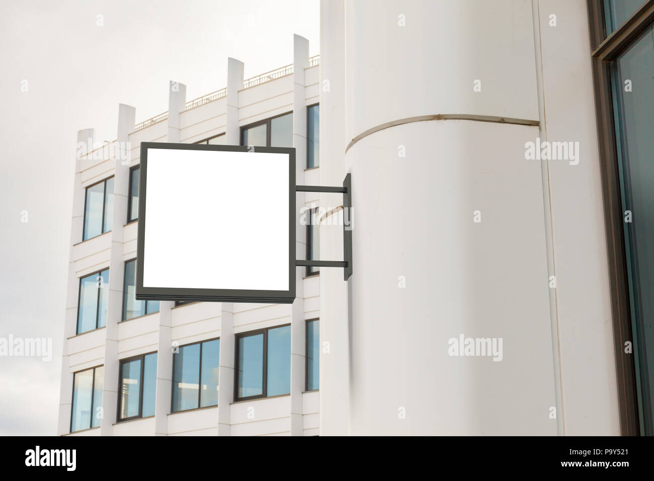 Blank square signboard on the white wall. 3d illustration Stock Photo ...