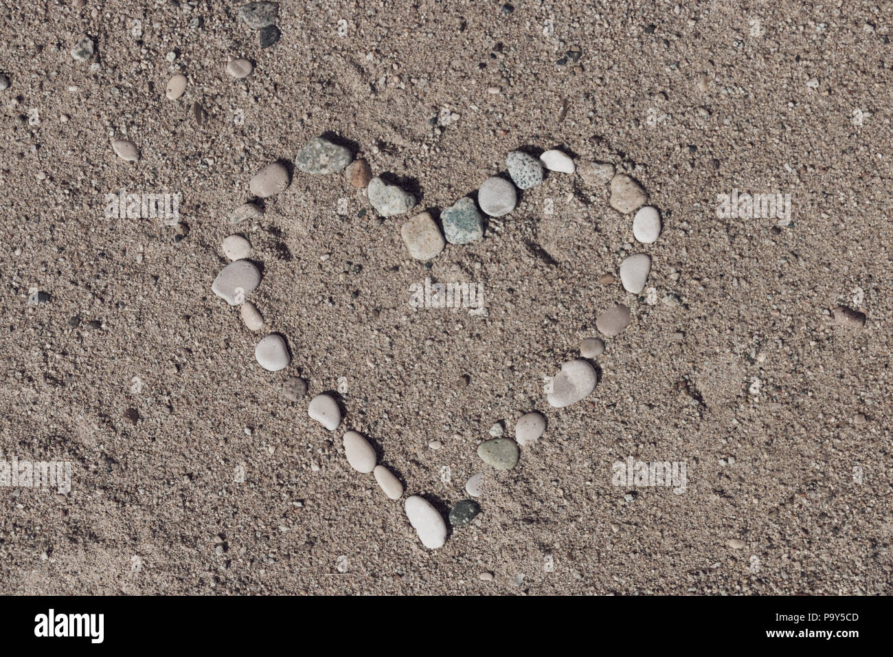 Heart shape on the beach with stones hi-res stock photography and ...