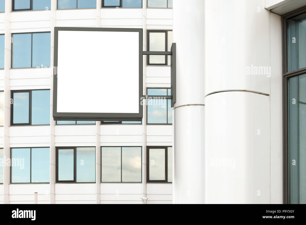 Blank square signboard on the white wall. 3d illustration Stock Photo ...