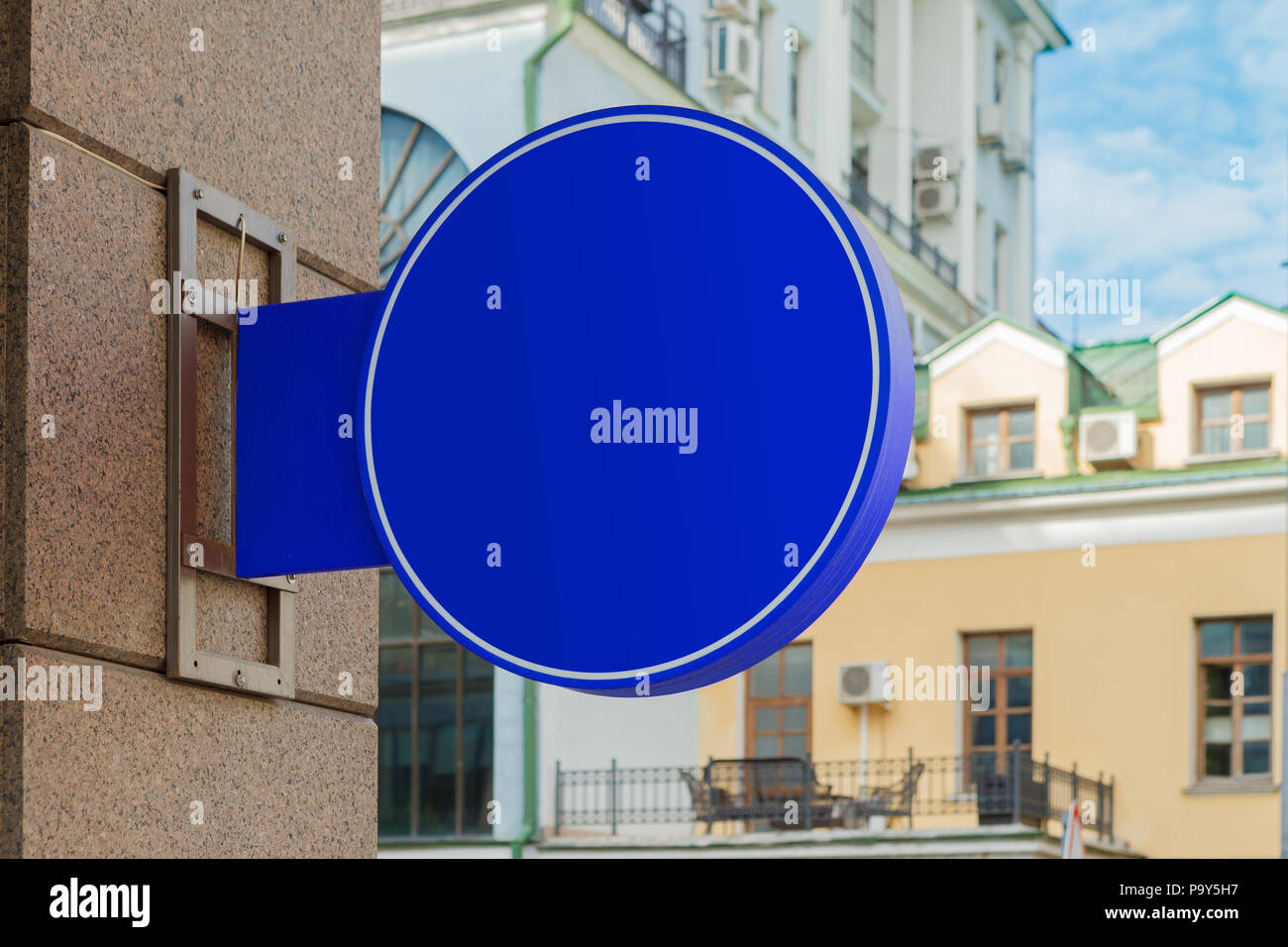 Blank blue round signboard on the granite wall Stock Photo - Alamy