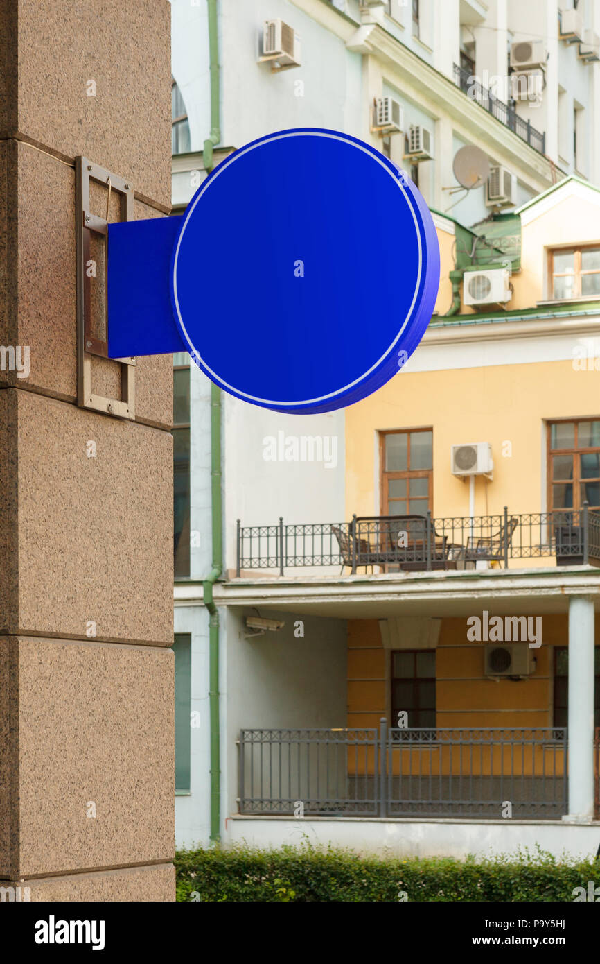 Blank blue round signboard on the granite wall Stock Photo - Alamy