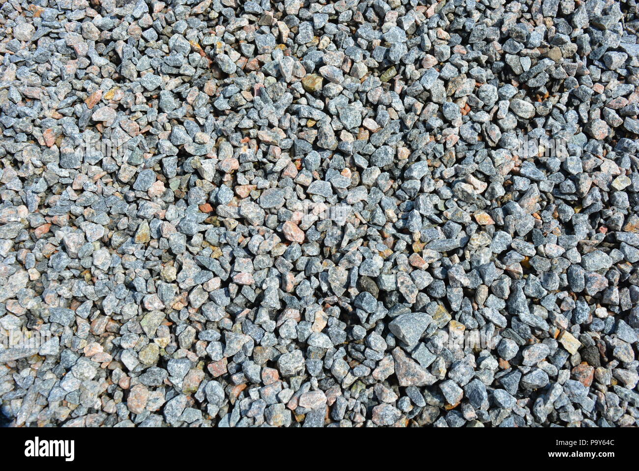 Building materials and fettling background, light crushed stone after ...