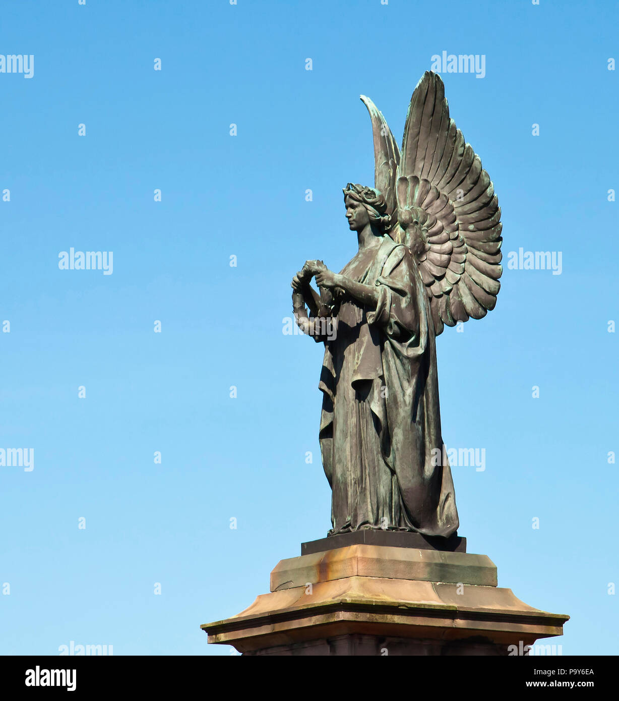 A photography of a great angel under a bright blue sky Stock Photo - Alamy