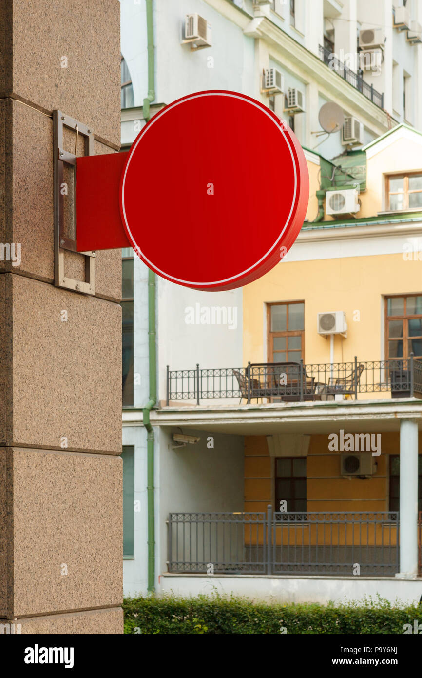 Blank red round signboard on the granite wall Stock Photo - Alamy