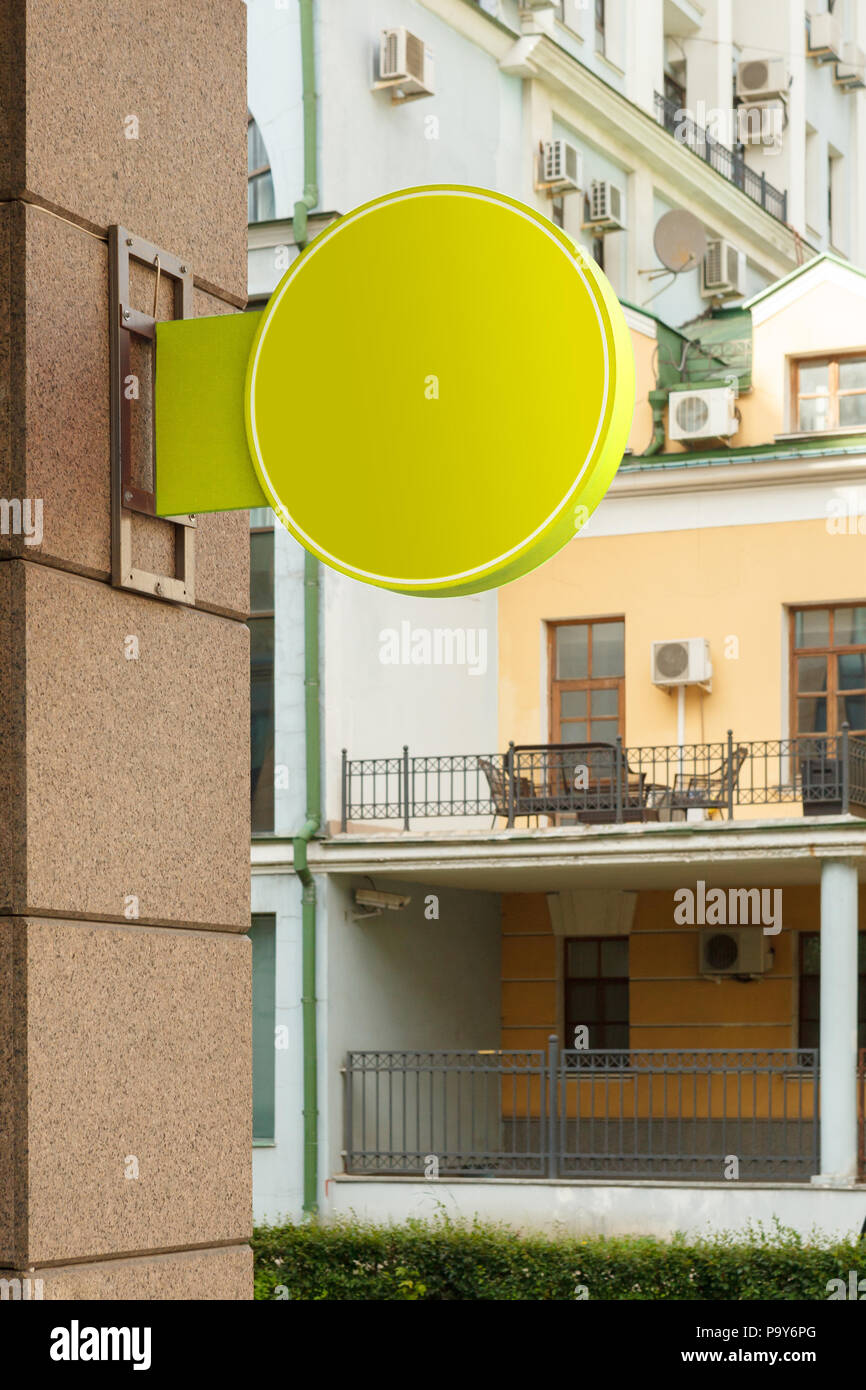 Blank yellow round signboard on the granite wall Stock Photo - Alamy