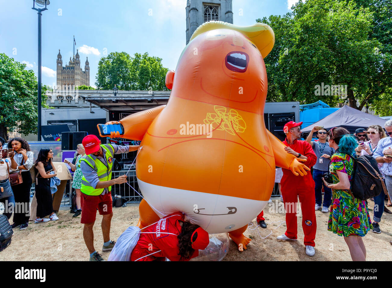 A Group Of Anti Trump Protestors With An ‘Angry Baby’ Inflatable Blimp ...