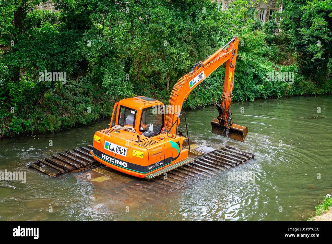 Large floating crane dredging river taken in Frome, Somerset, UK on 19 ...