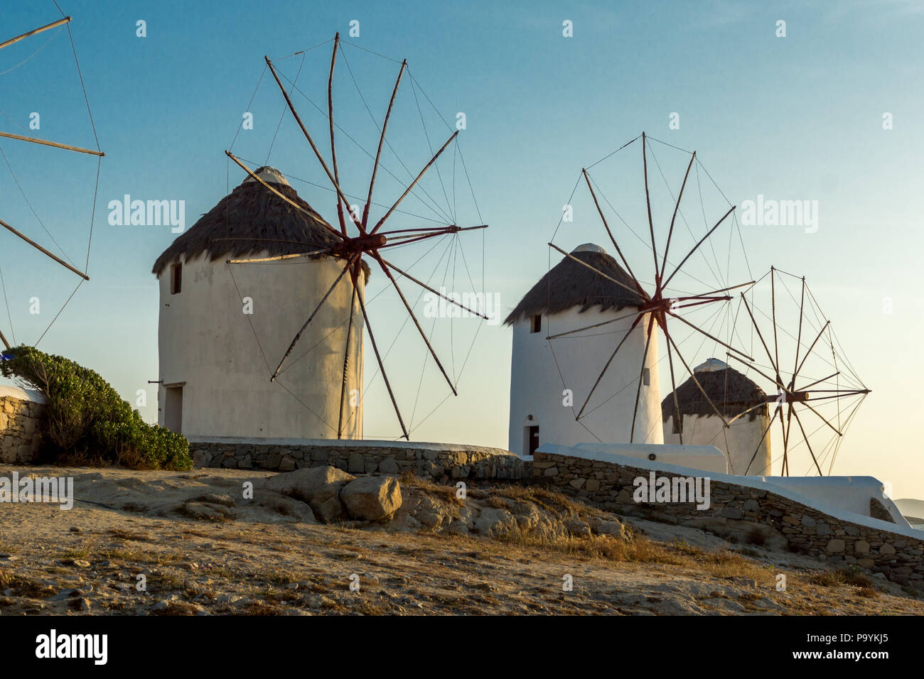 Amazing Sunset and White windmills on the island of Mykonos, Cyclades ...