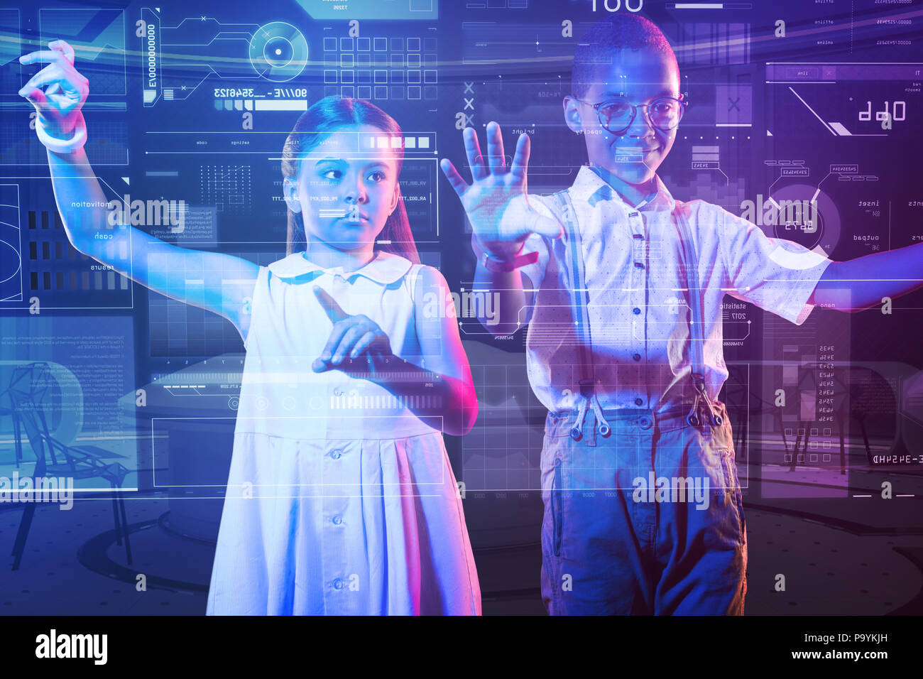 Progressive kids standing in front of the transparent screen and ...