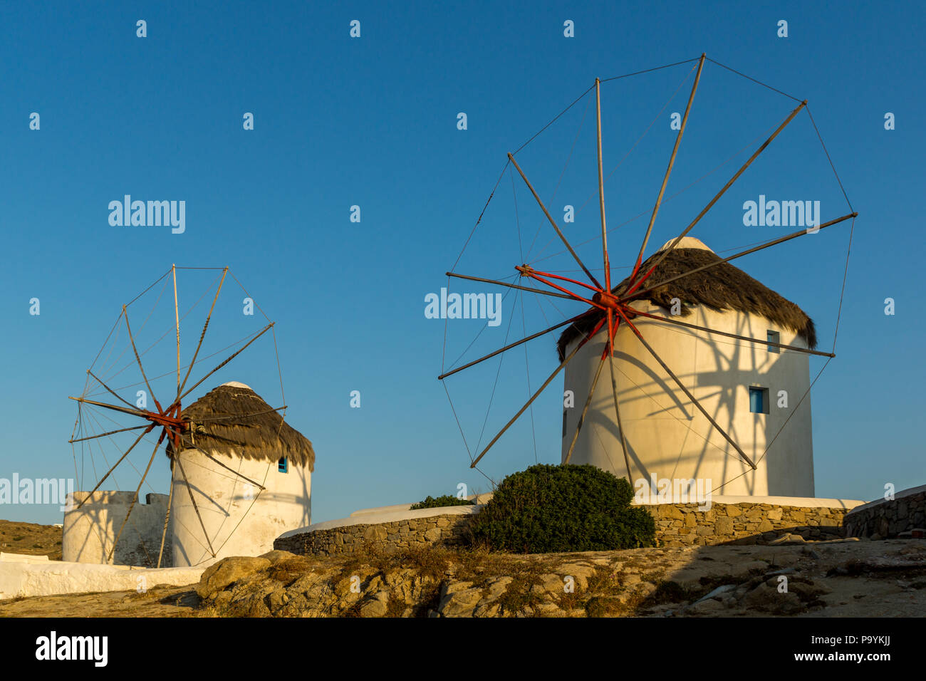 Amazing Sunset and White windmills on the island of Mykonos, Cyclades ...