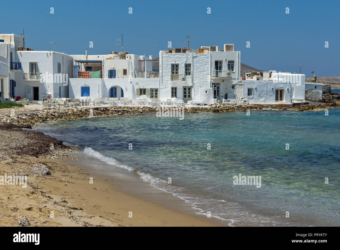 Old white house and Bay in Naoussa town, Paros island, Cyclades, Greece ...