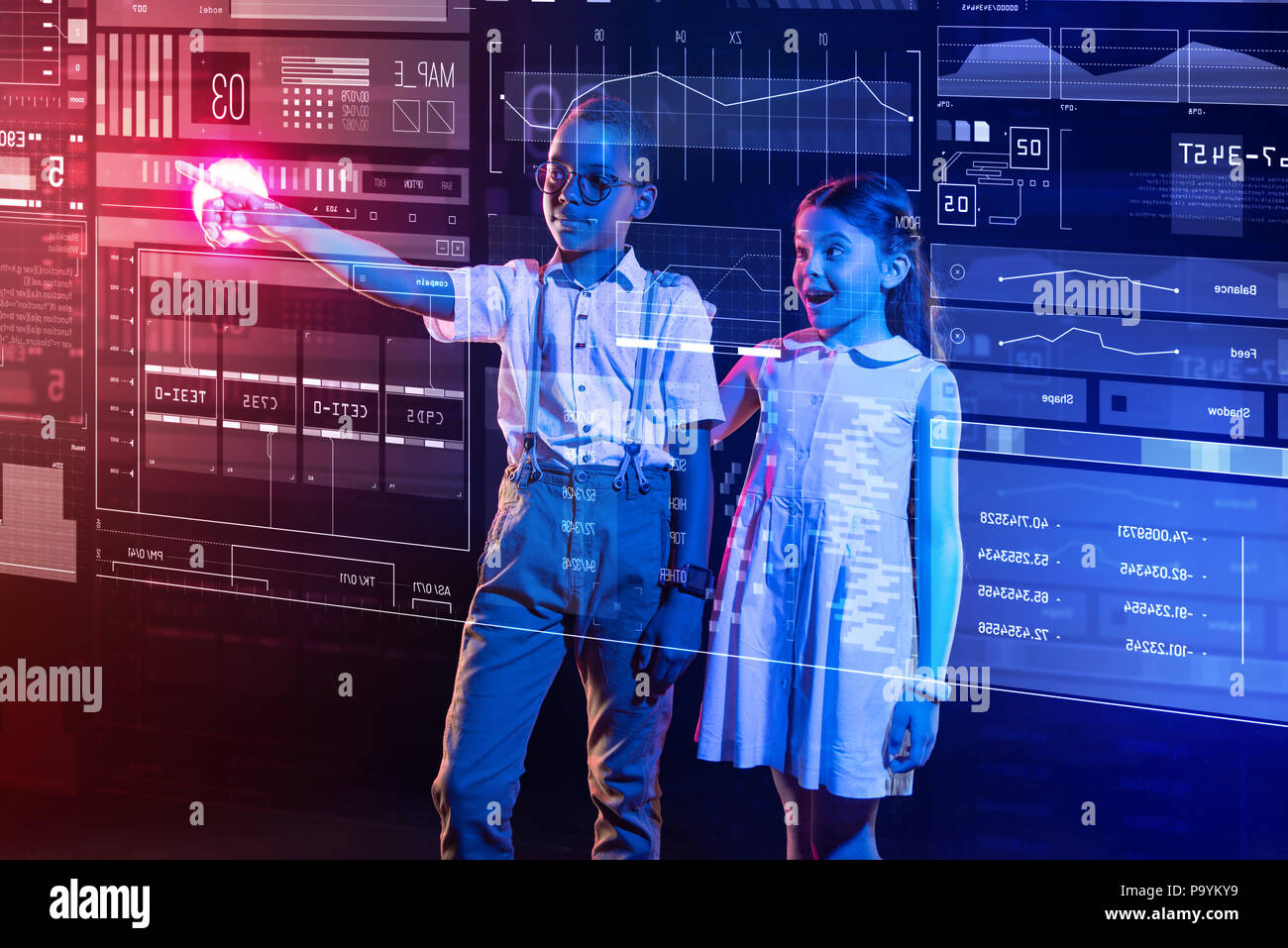 Cute girl looking excited while testing a new program with her friend ...