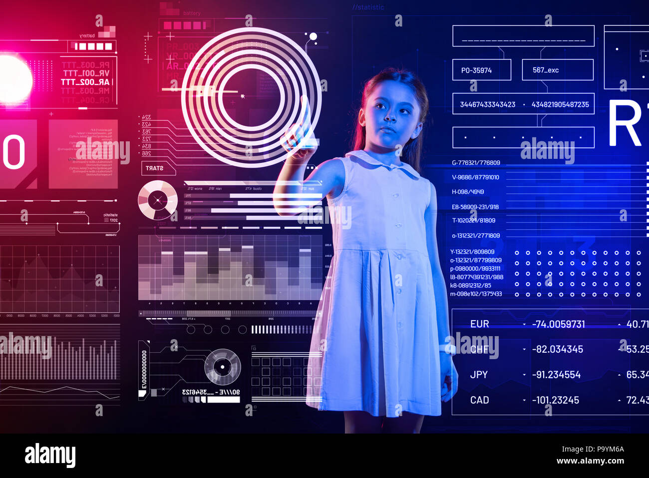 Serious girl pointing to the screen and thinking Stock Photo - Alamy
