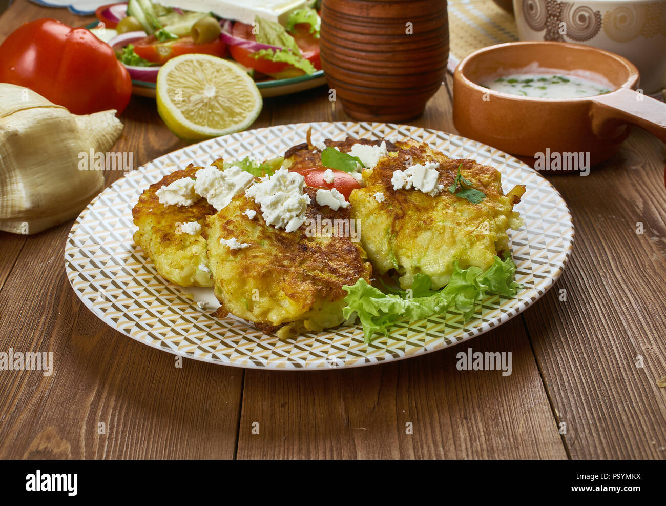 Kolokythokeftees, zucchini tots, Greek cuisine , Traditional assorted ...