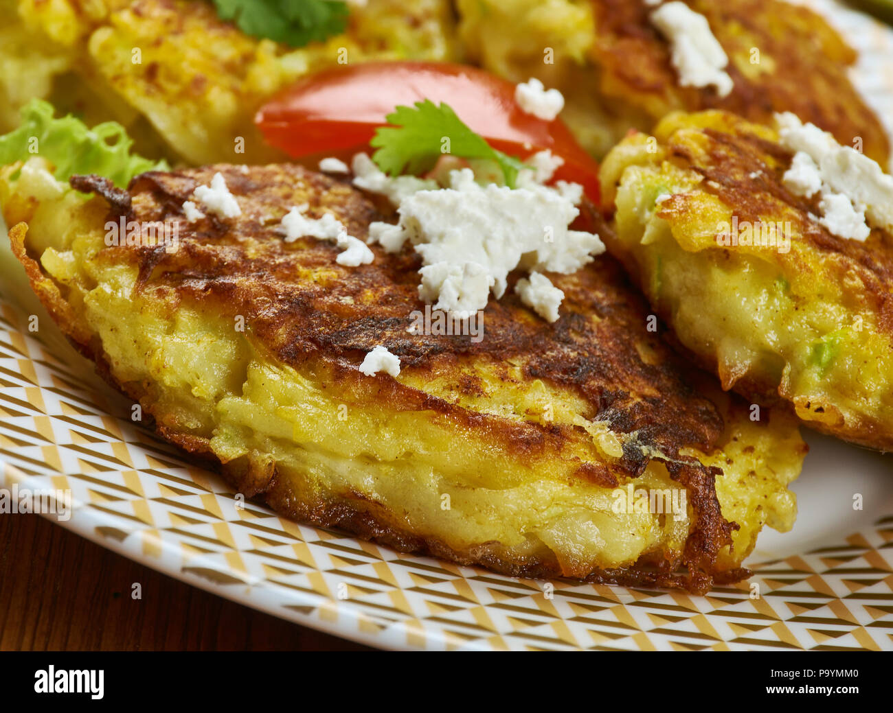 Kolokythokeftees, zucchini tots, Greek cuisine , Traditional assorted ...