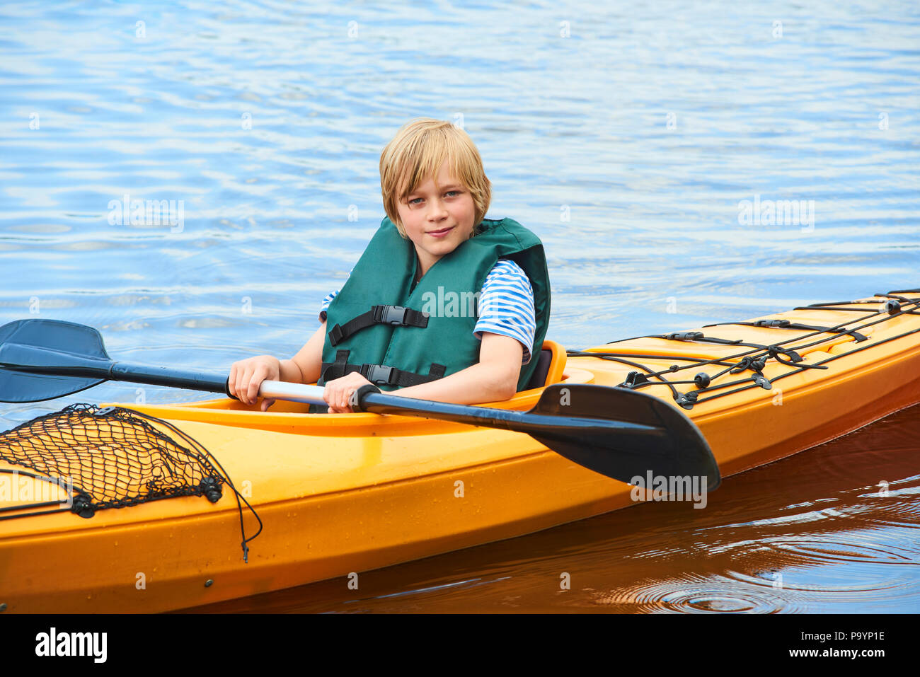 Active happy child. Teenage school boy having fun enjoying adventurous ...