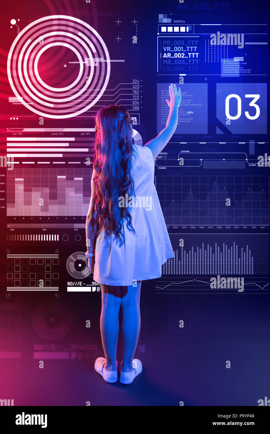 Long haired girl putting her hand up and touching the screen Stock ...