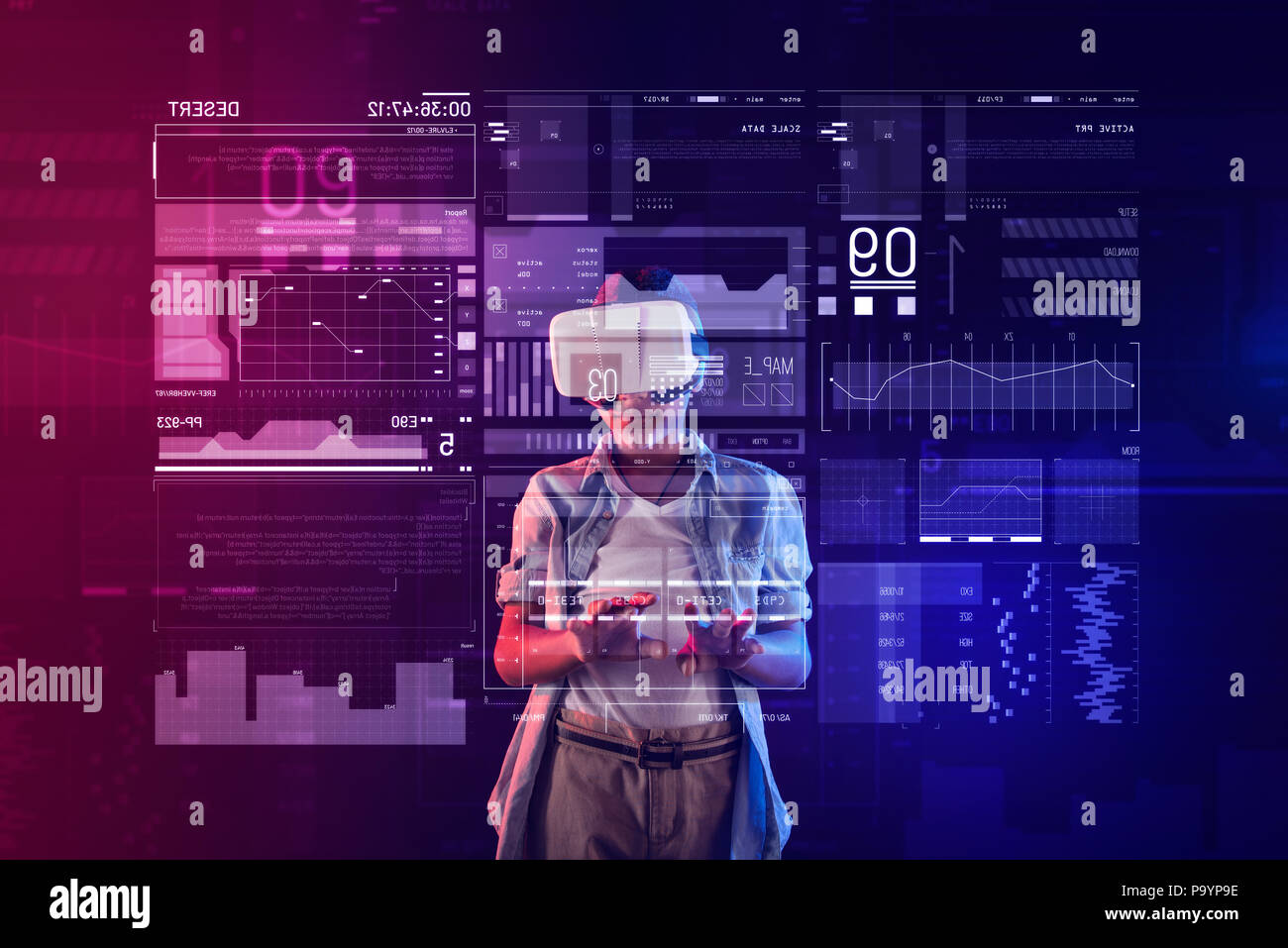 Clever kid creating a program while using virtual reality glasses Stock ...