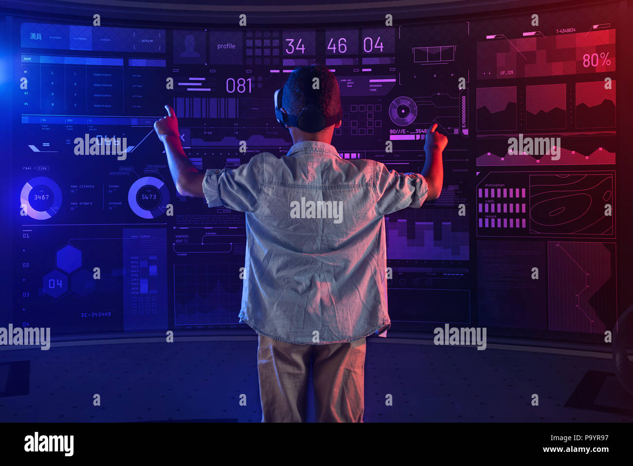 Serious boy visiting computer courses and looking concentrated Stock ...