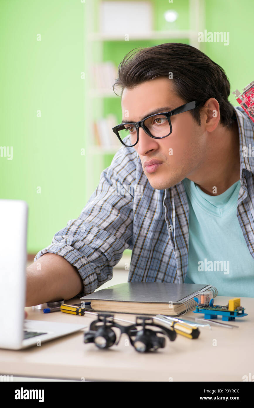 Computer engineer repairing broken desktop Stock Photo - Alamy