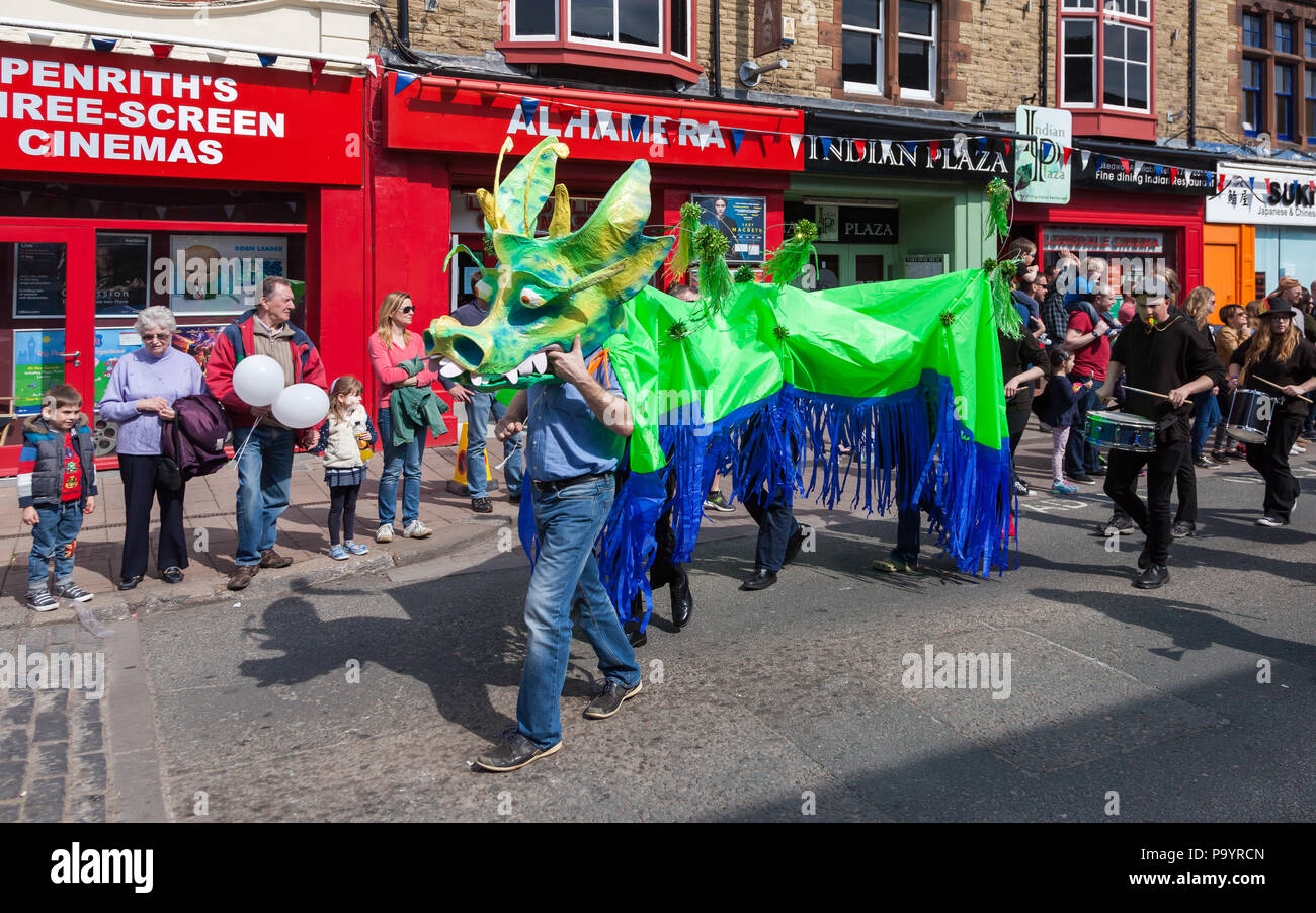 A green and blue dragon takes part in the annual May Day parade in ...