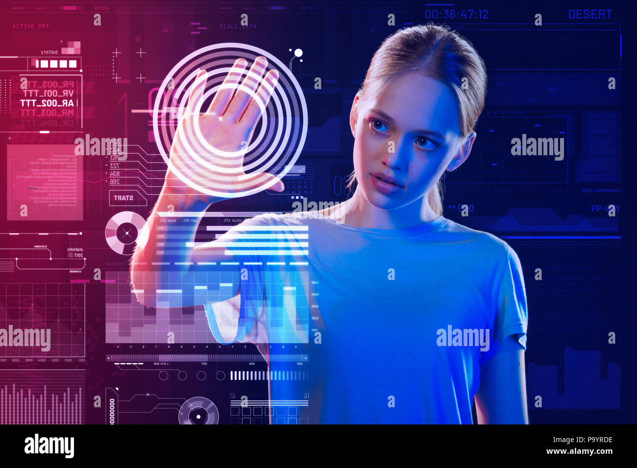 Thoughtful girl looking concentrated while using futuristic ...