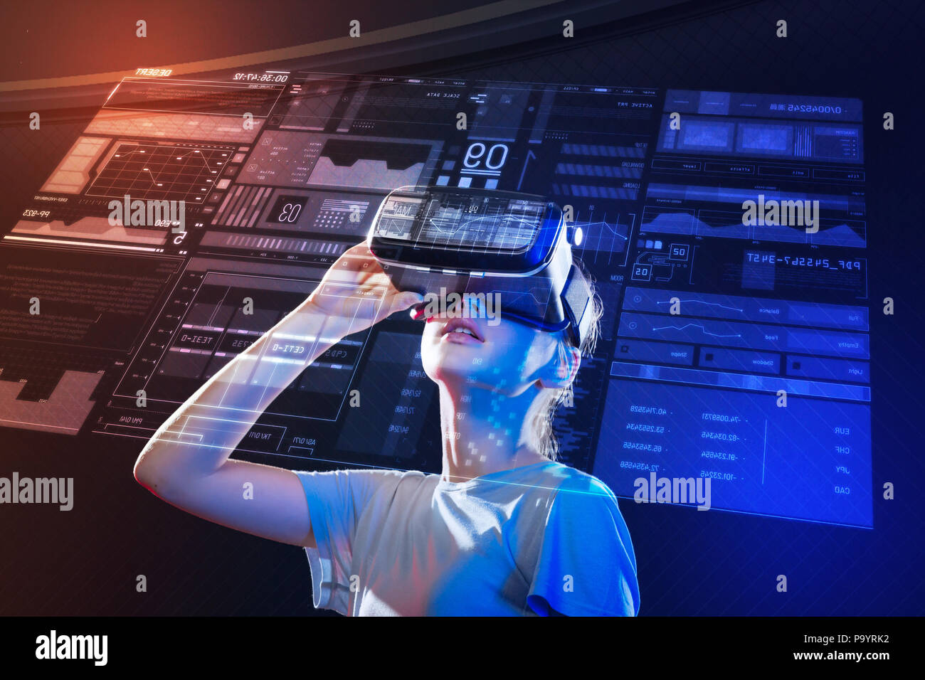Curious girl feeling interested while wearing virtual reality glasses ...