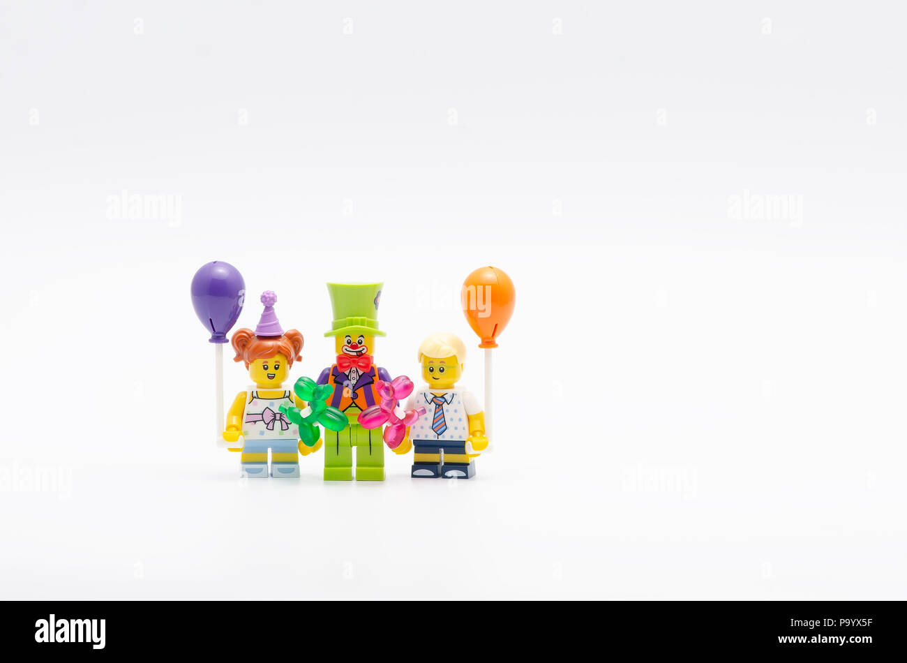 lego clown, girl and a boy holding balloon. Lego minifigures are ...