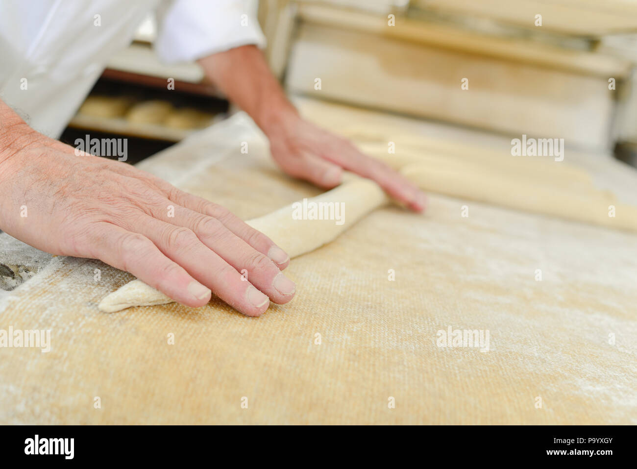 Rolling bread dough Stock Photo - Alamy