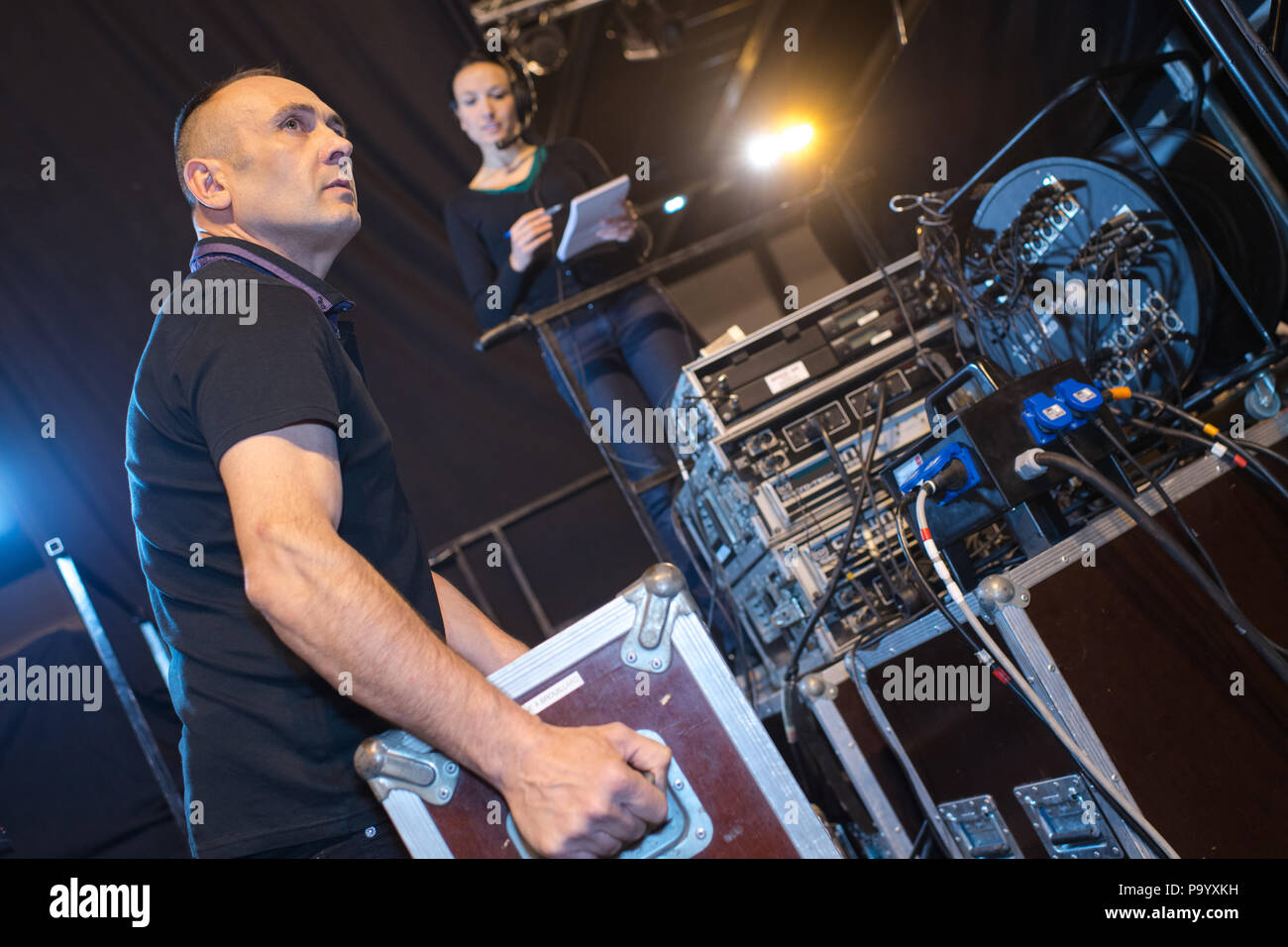 producer working on digital studio mixer for a tv broadcasting Stock ...