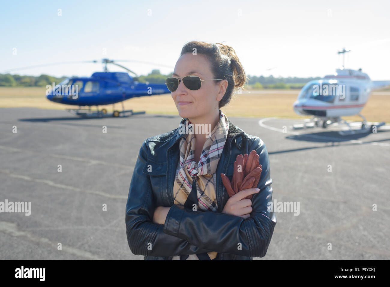 beautiful woman waiting for helicopter Stock Photo - Alamy
