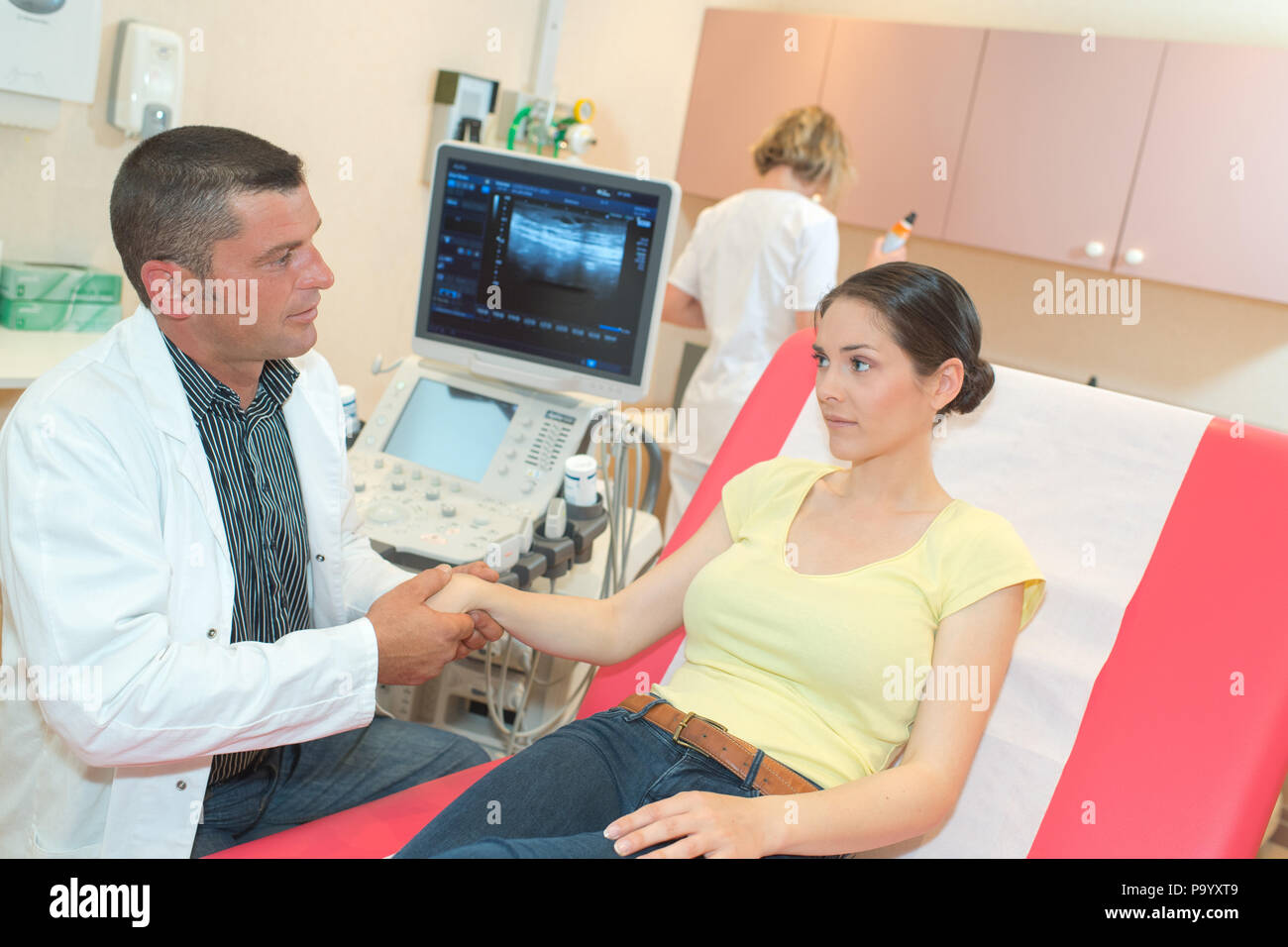 doctor with female patient undergoing echography Stock Photo - Alamy